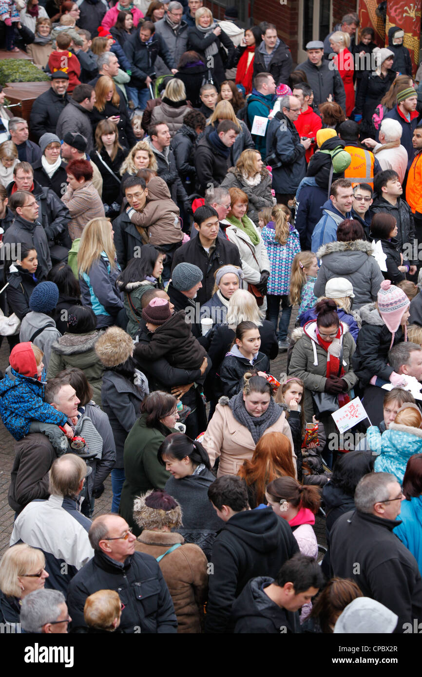 Crowds of people viewed from above gathered outdoors for an event Stock ...