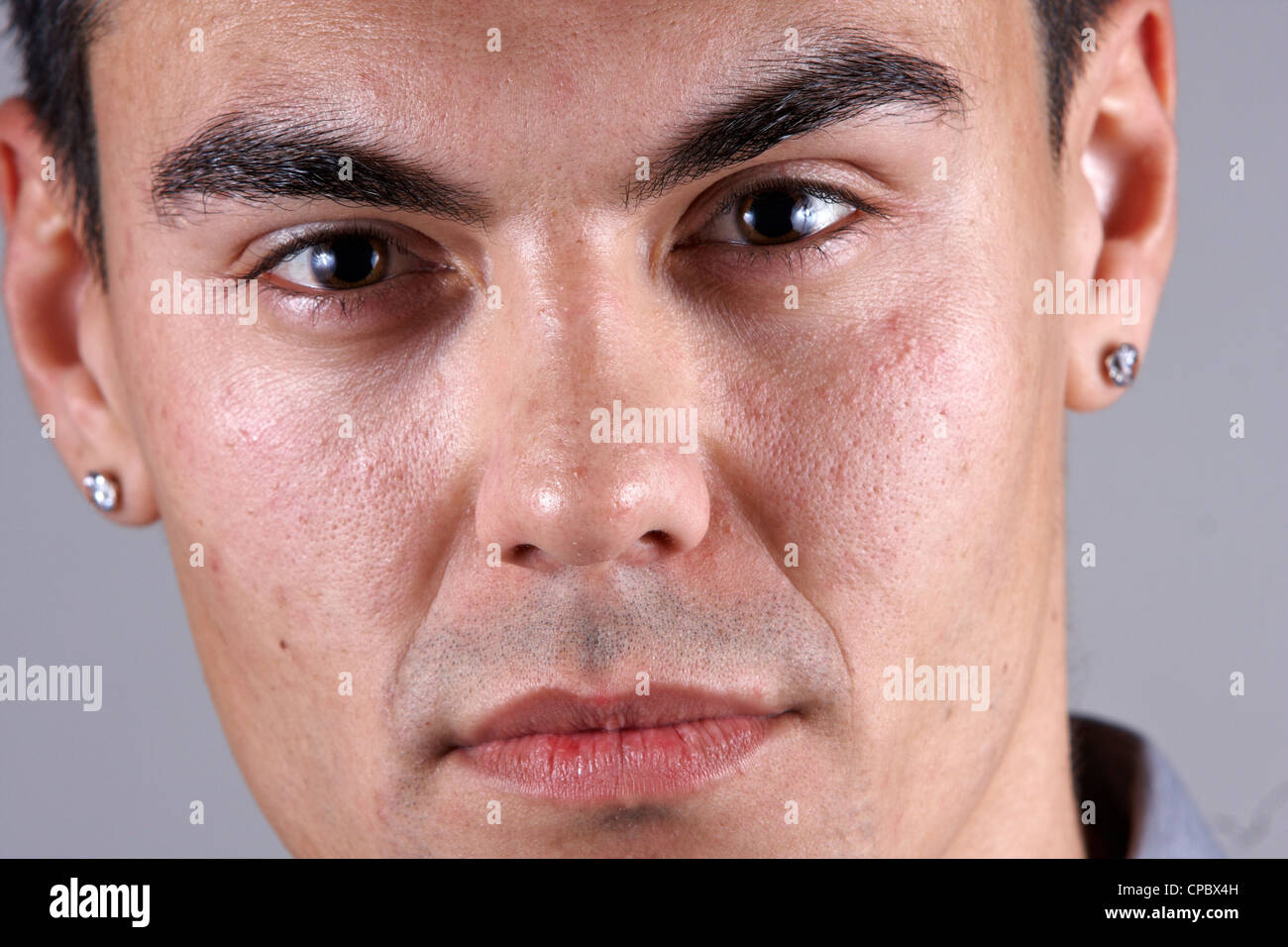 Close up of a white man's face on grey background (not retouched Stock ...