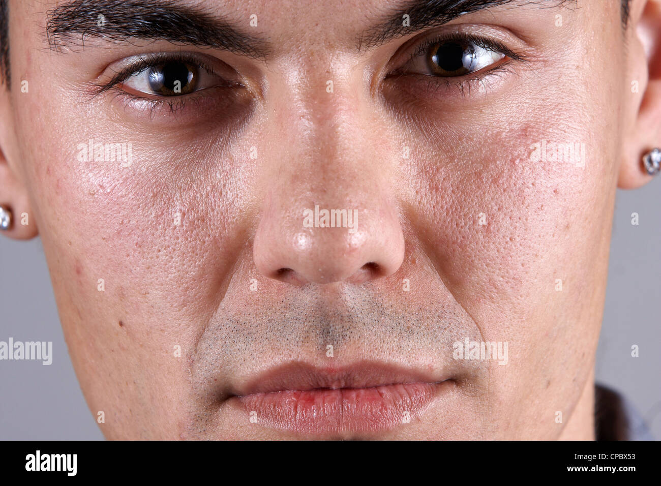 Close up of a white man's face on grey background (not retouched Stock ...
