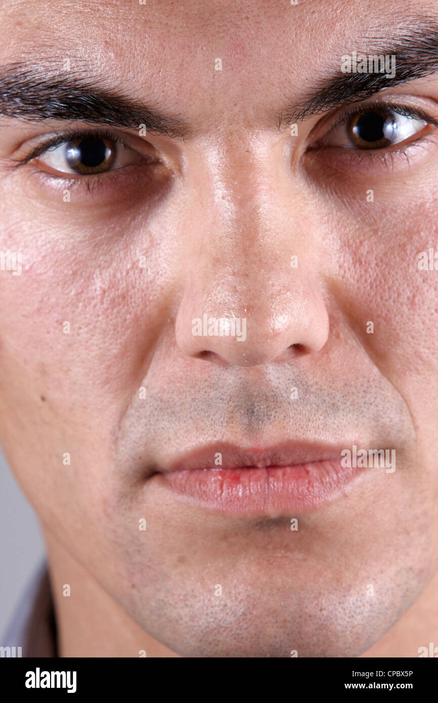 Close up of a white man's face on grey background (not retouched Stock ...