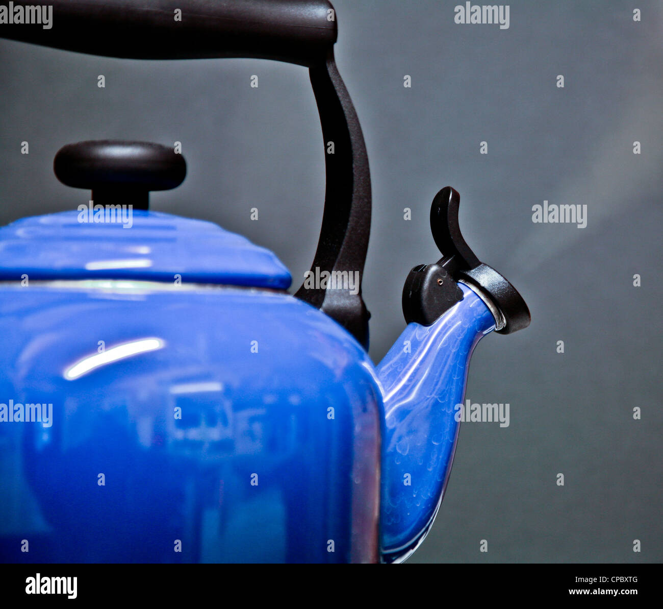 Traditional kettle boiling with steam shooting out through the spout ...