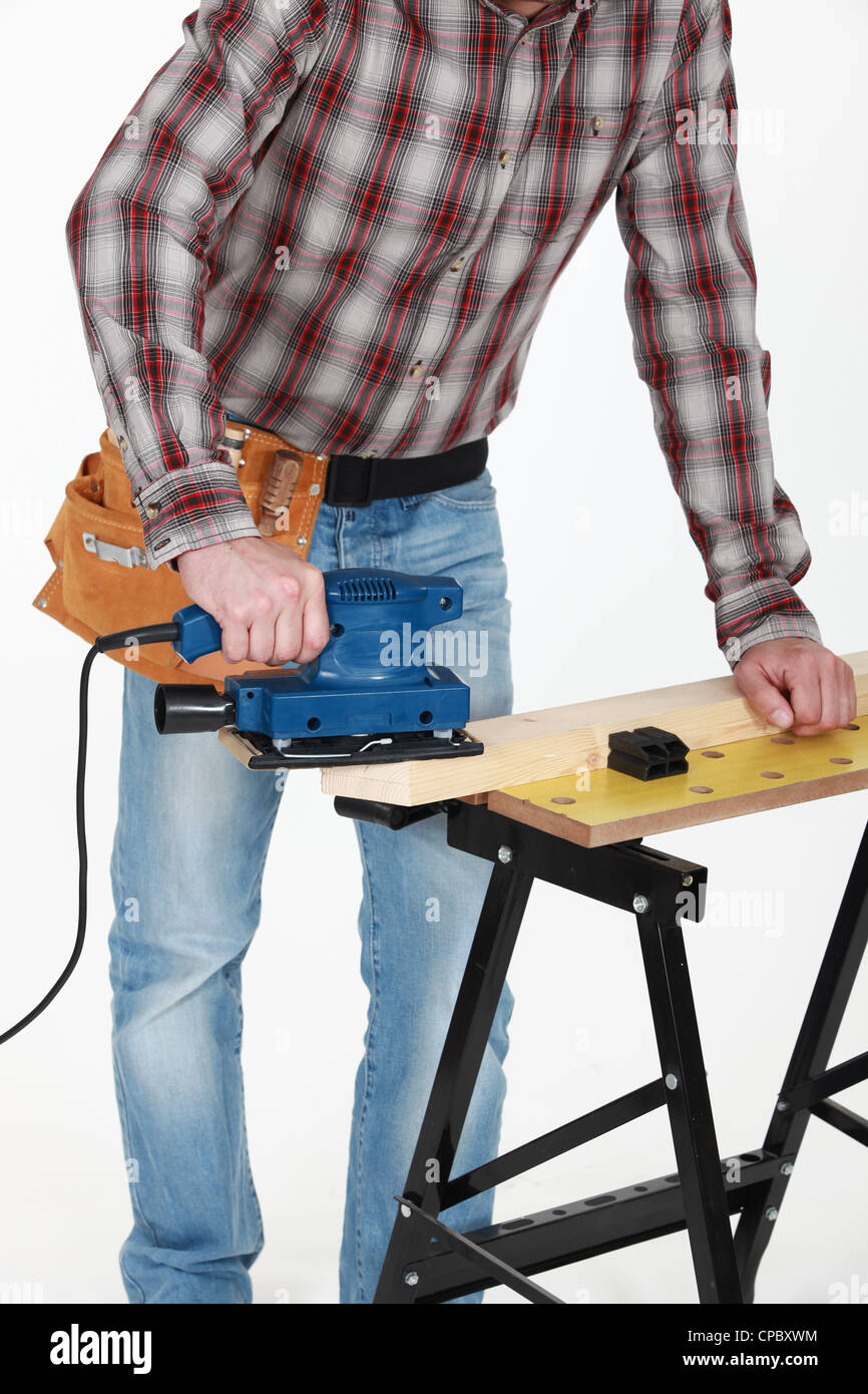 carpenter at work with sander machine Stock Photo - Alamy