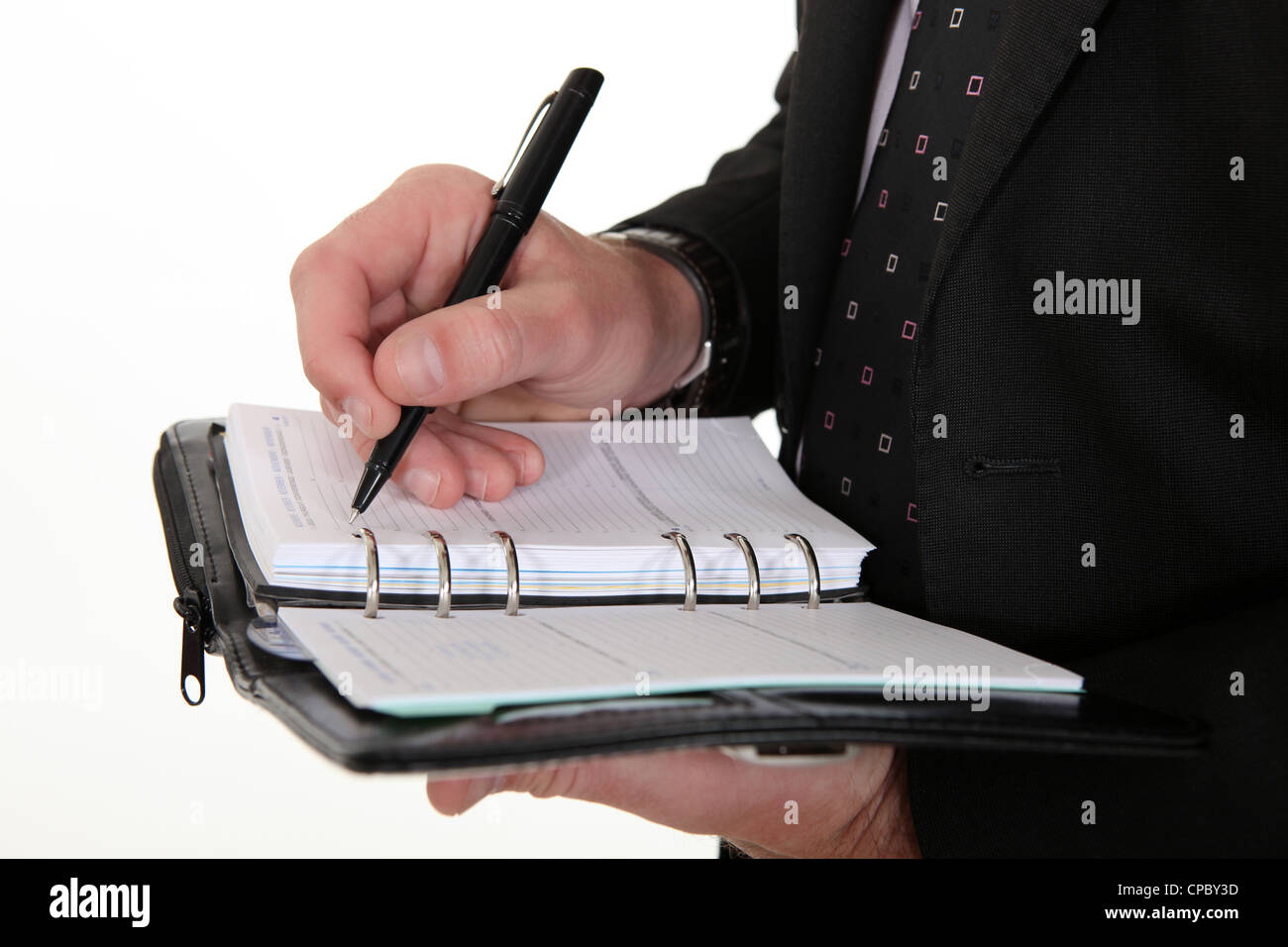 businessman noting down appointment on agenda Stock Photo - Alamy