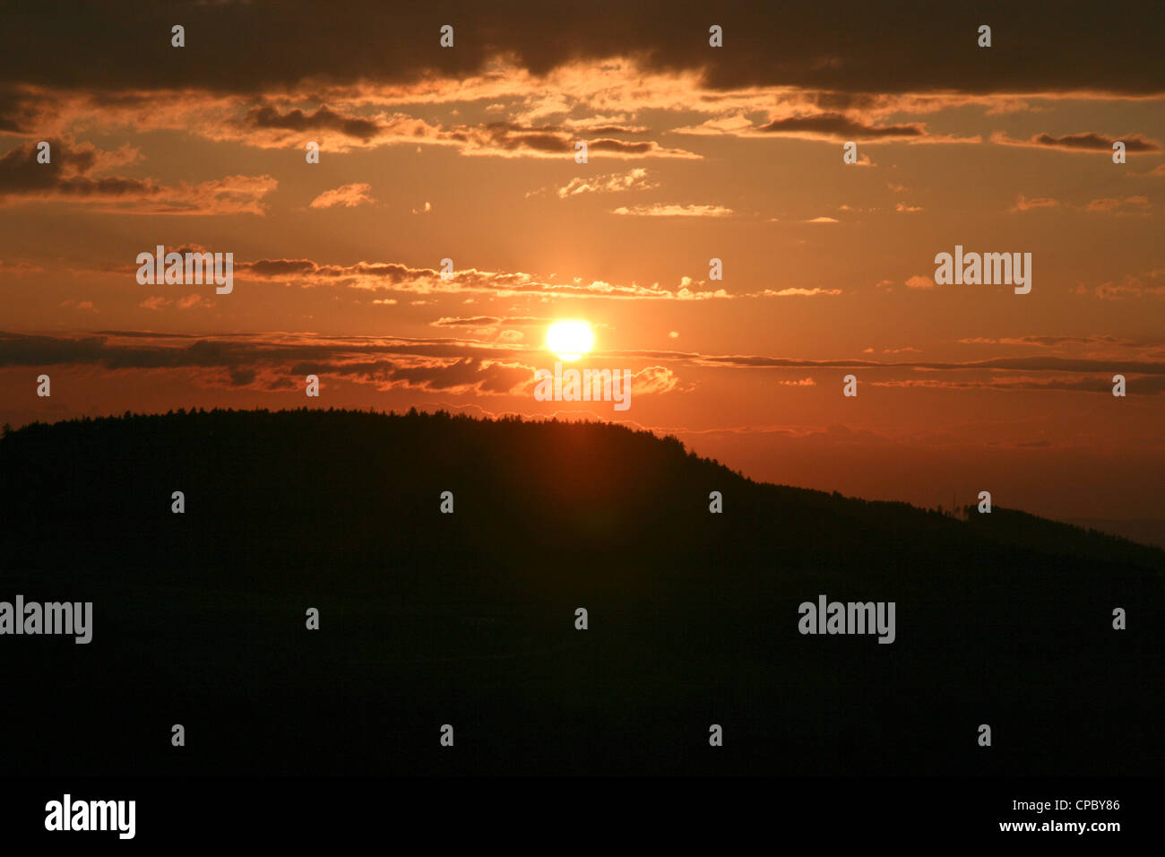 Deep golden sunset over hills in Jonschwil, Switzerland Stock Photo - Alamy