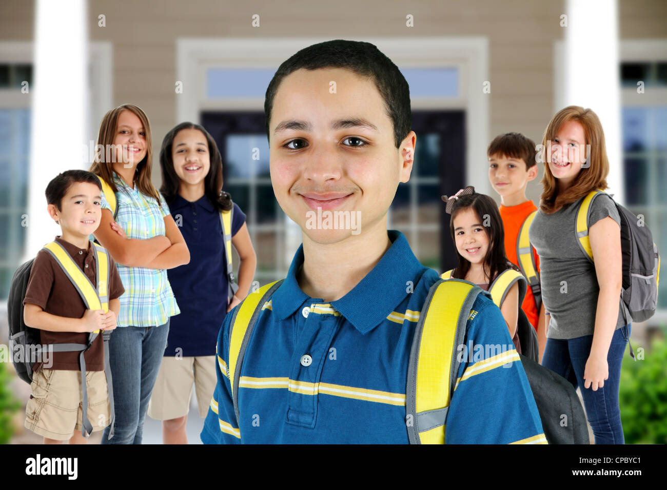 Group of children standing in front of their school Stock Photo - Alamy
