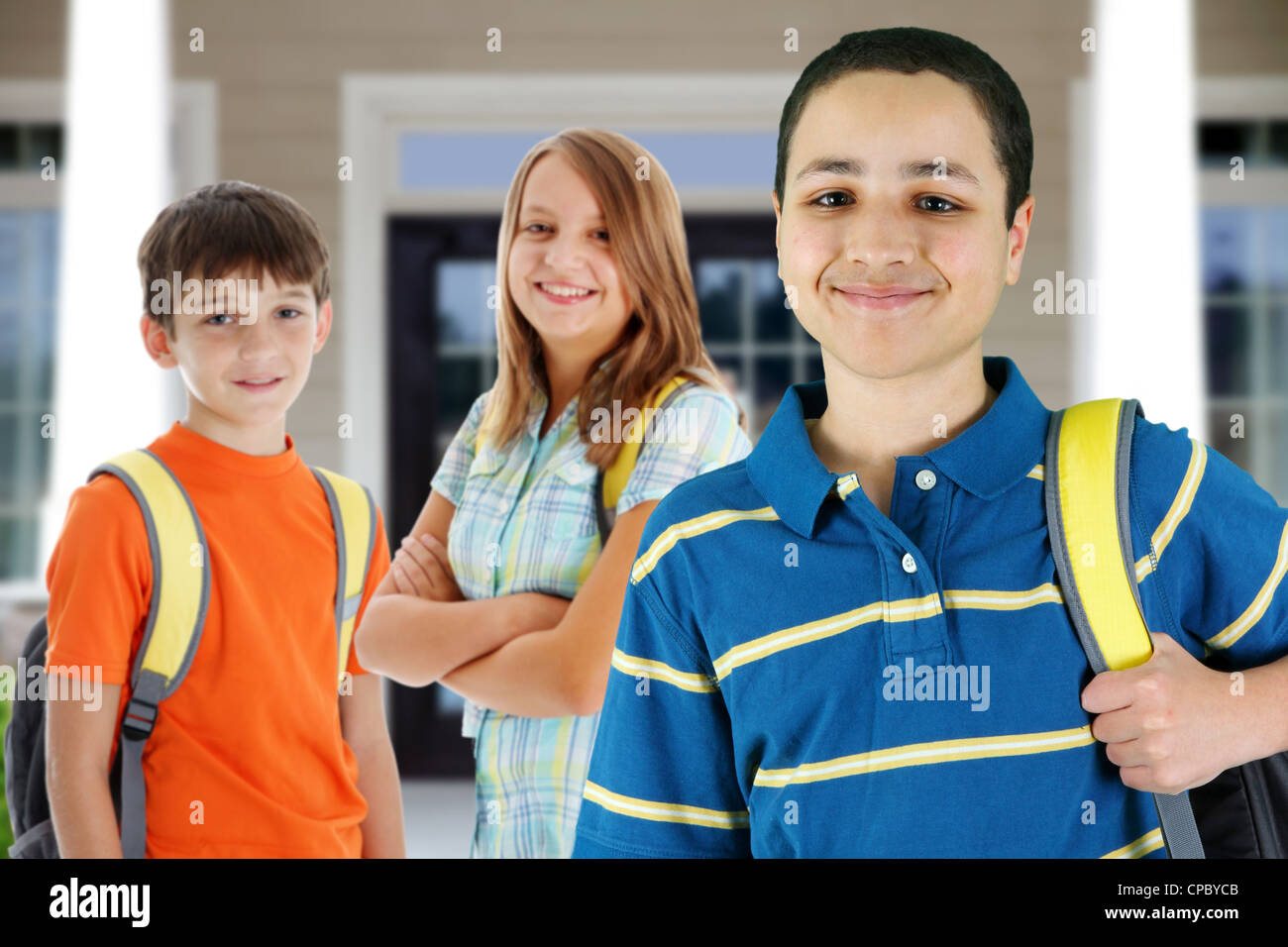 Group of children standing in front of their school Stock Photo - Alamy