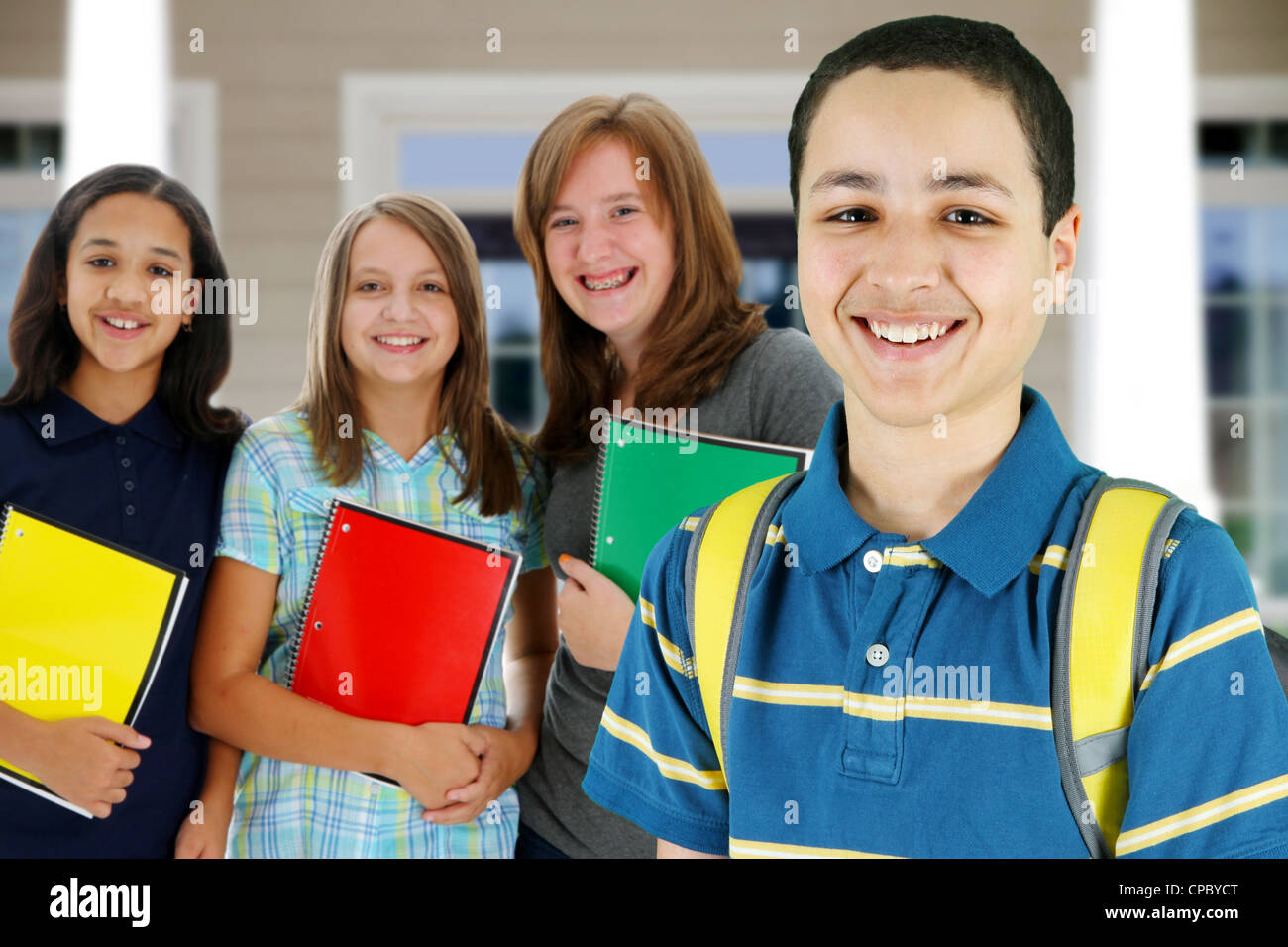 Group of children standing in front of their school Stock Photo - Alamy