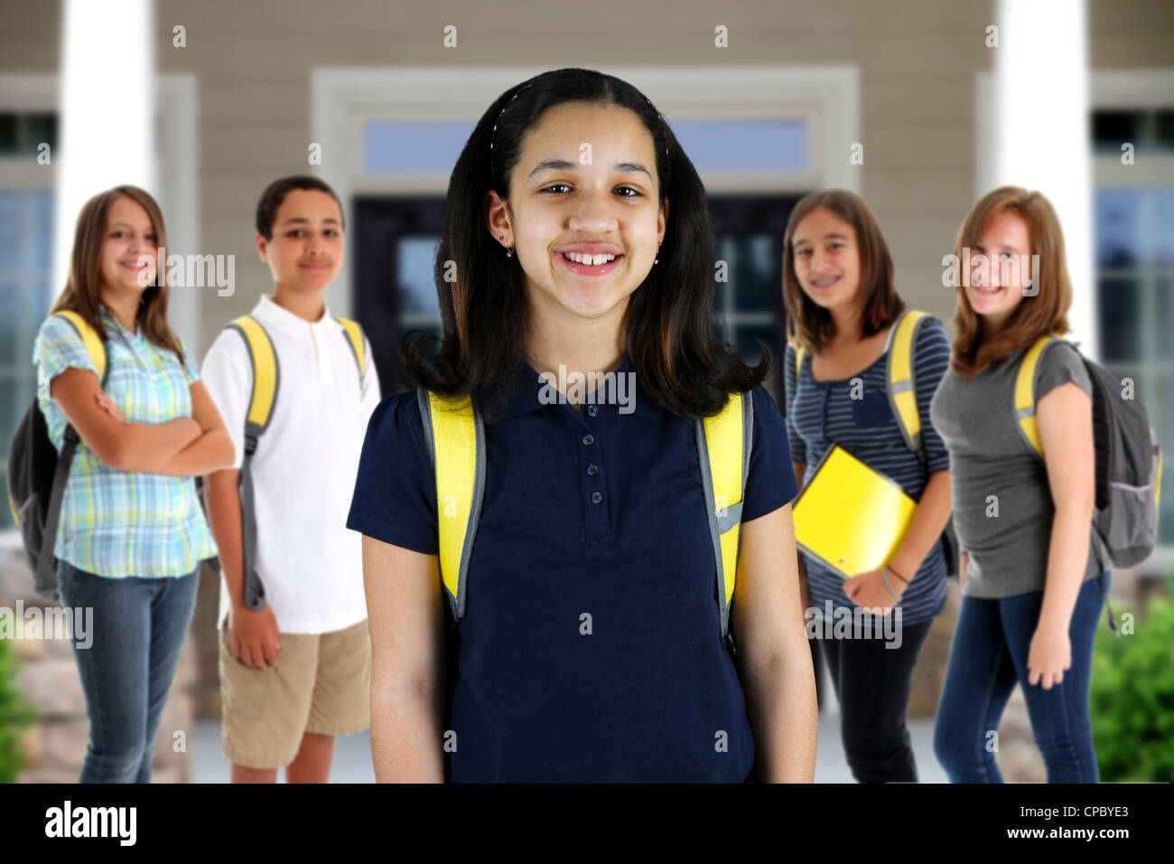 Group of children standing in front of their school Stock Photo - Alamy