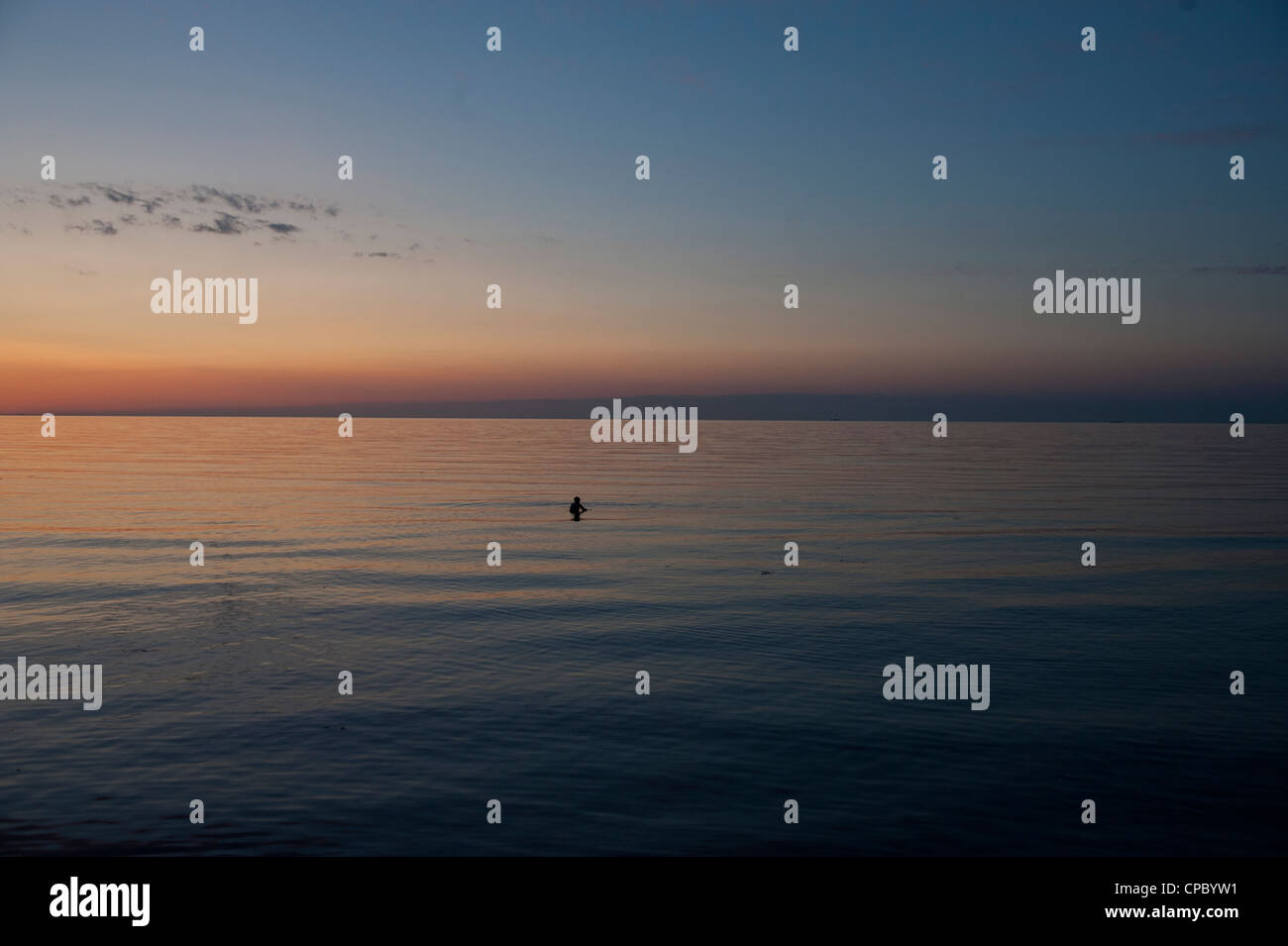 Lone figure by water hi-res stock photography and images - Alamy