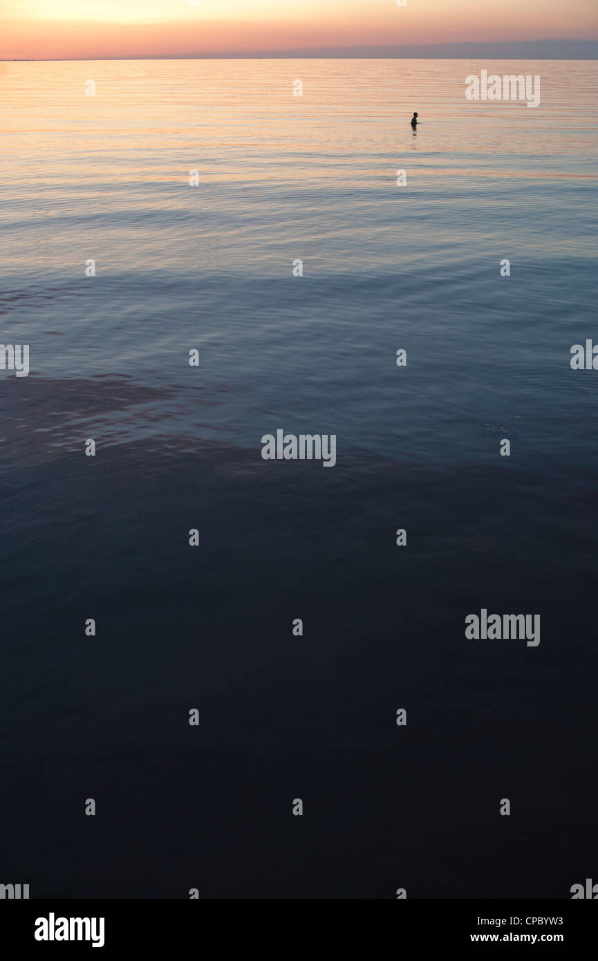 Lone figure by water hi-res stock photography and images - Alamy