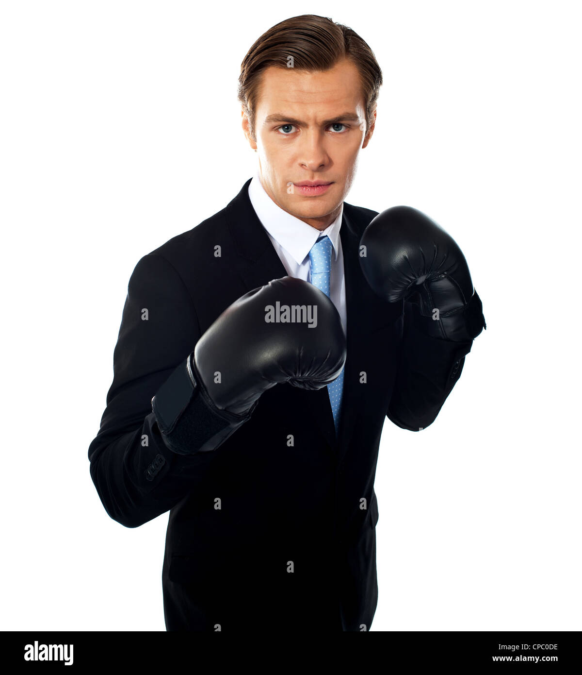 Handsome businessman posing in boxing gloves over white background ...