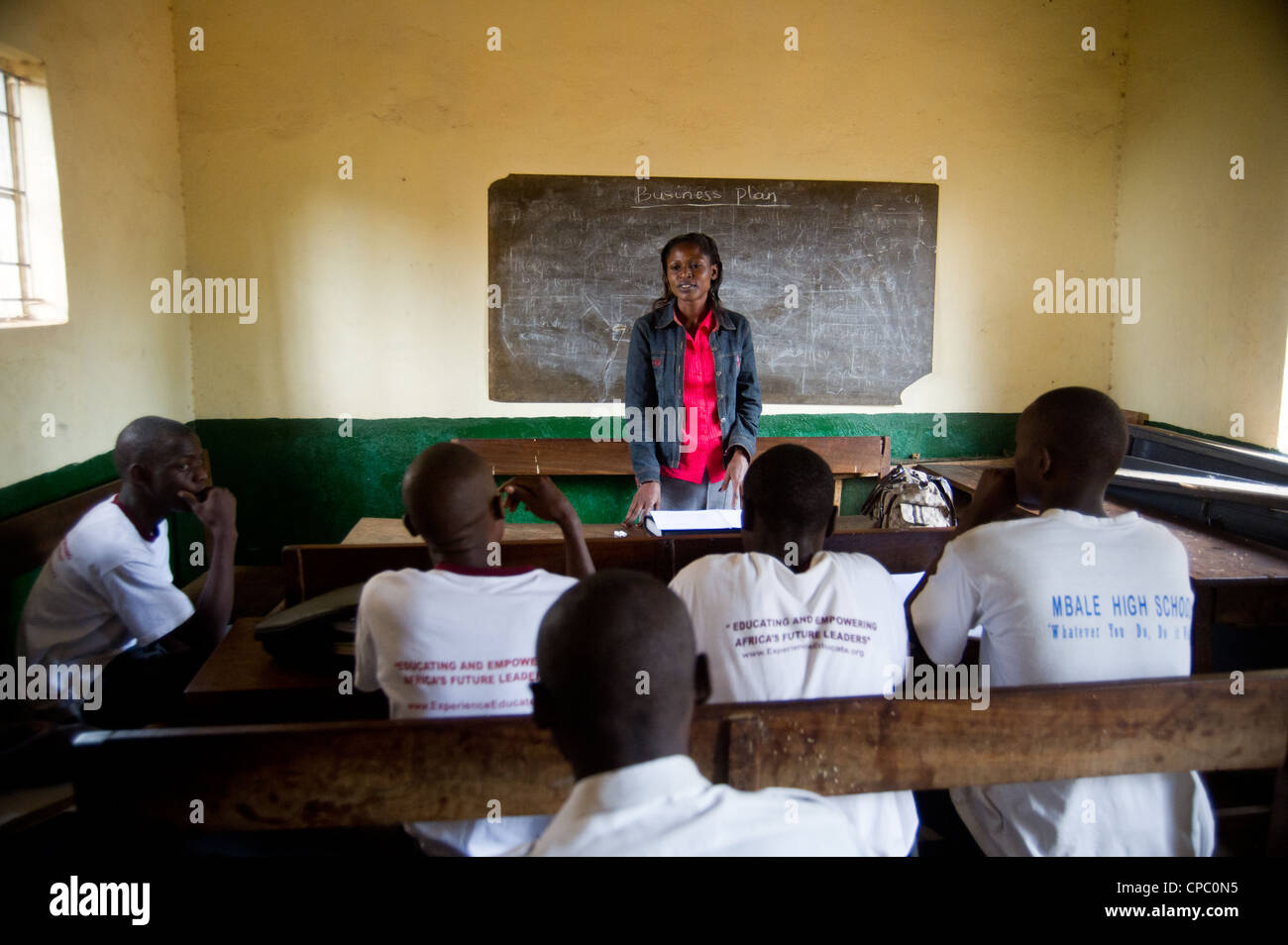 Students in an entrepreneurship club listen as their mentor teaches at ...