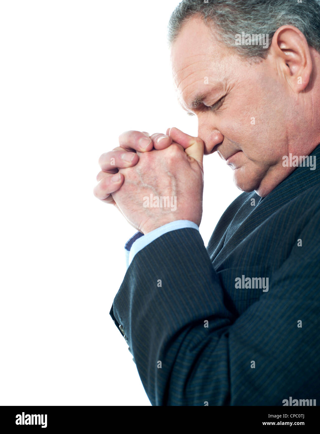 Portrait of matured businessman praying isolated on white background ...