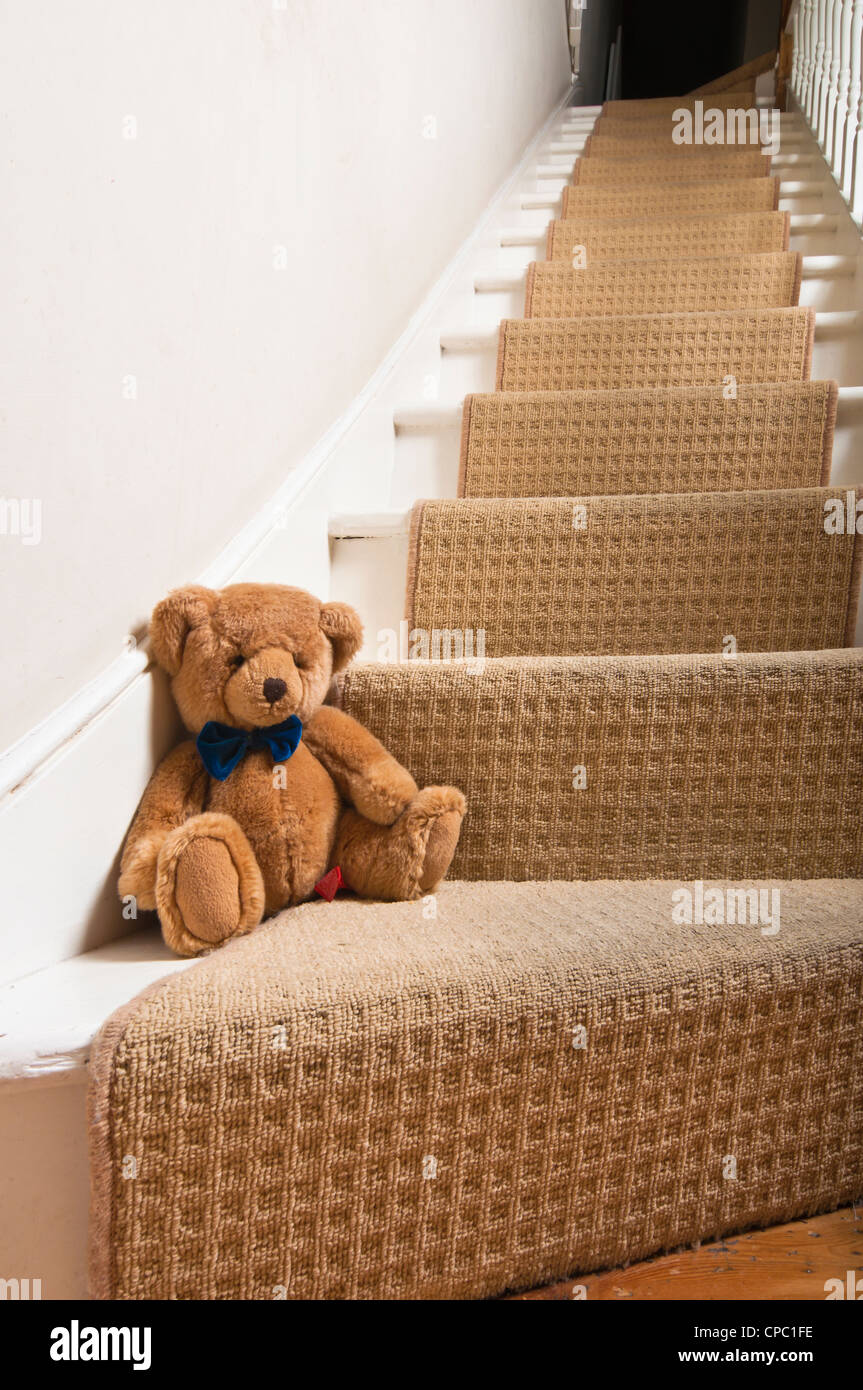 Teddy bear on stairs Stock Photo - Alamy