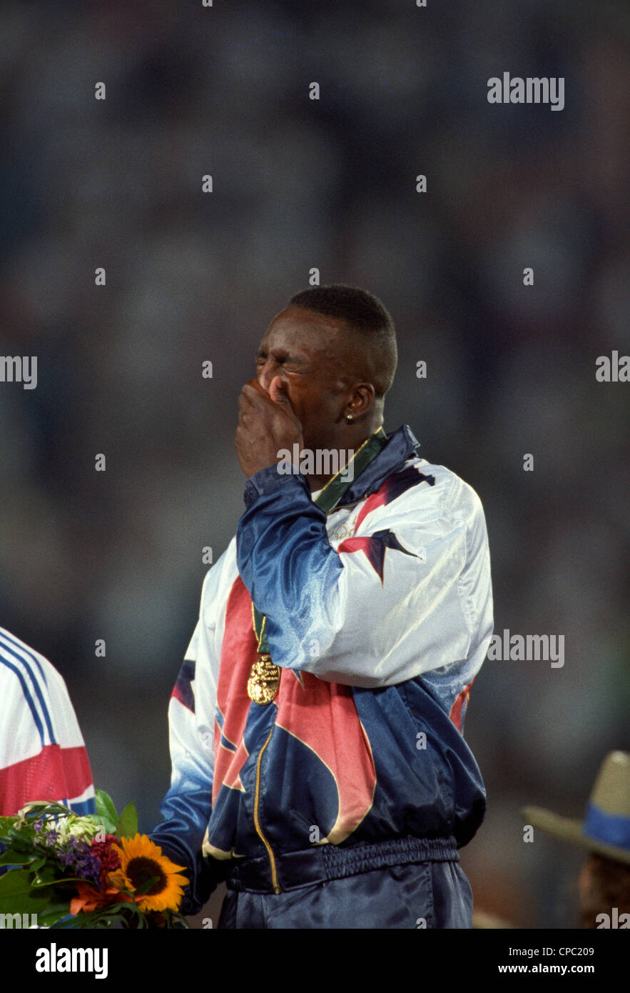 Michael Johnson on the podium after receiving his gold medal for the ...