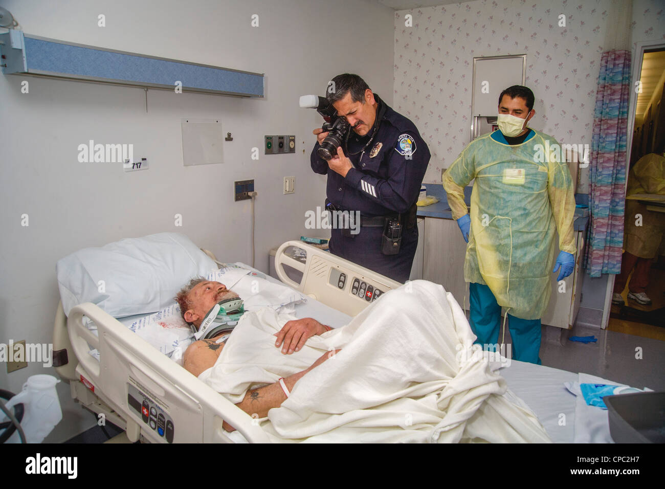 At a local hospital a Hispanic police crime scene investigator ...