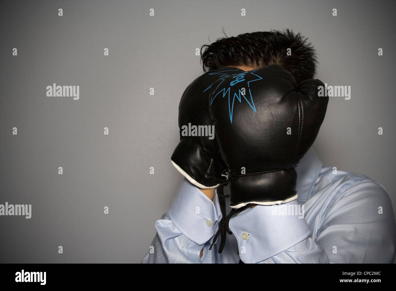 aggressive businessman ready to punch everyone Stock Photo - Alamy