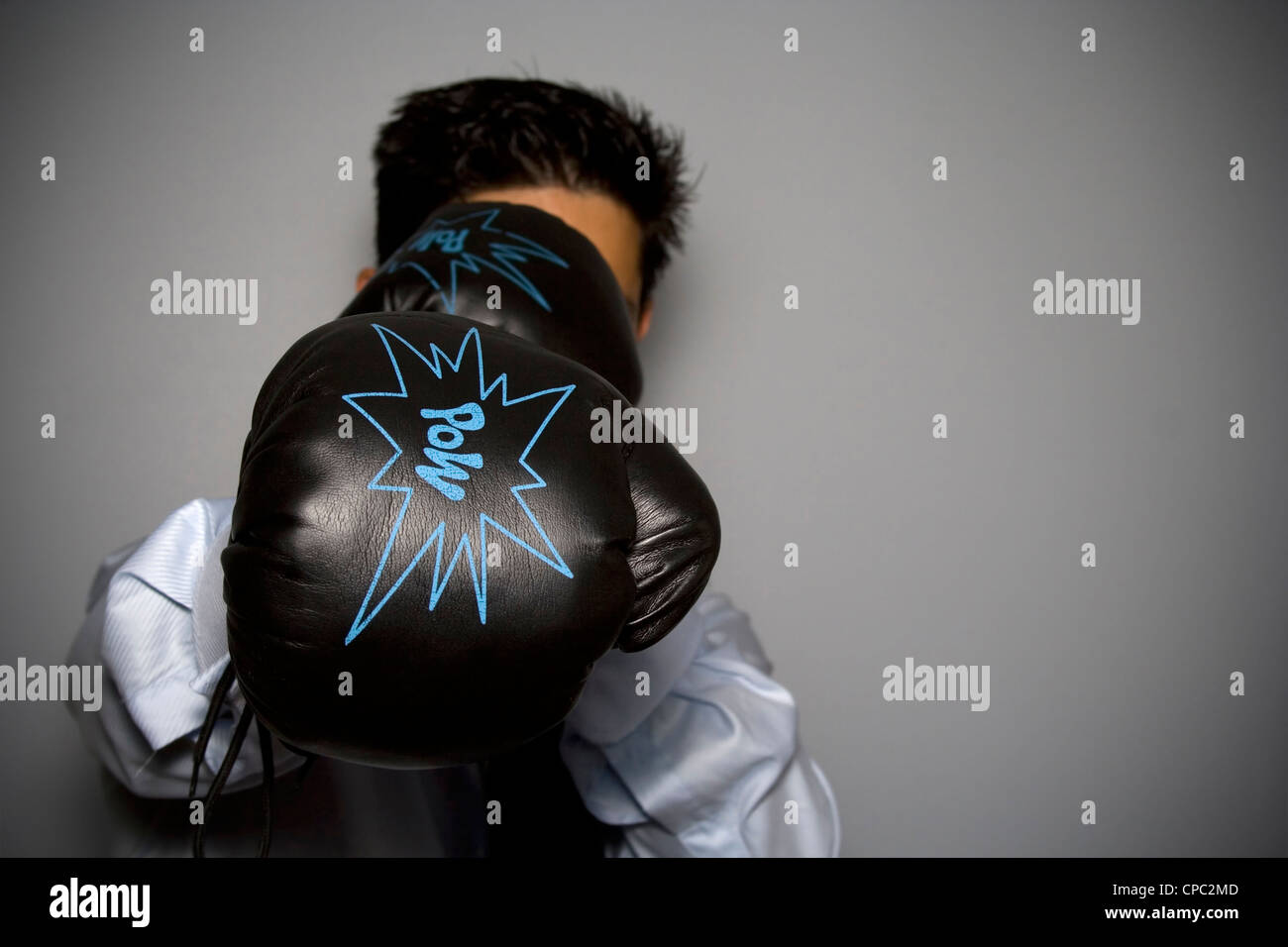 aggressive businessman ready to punch everyone Stock Photo - Alamy