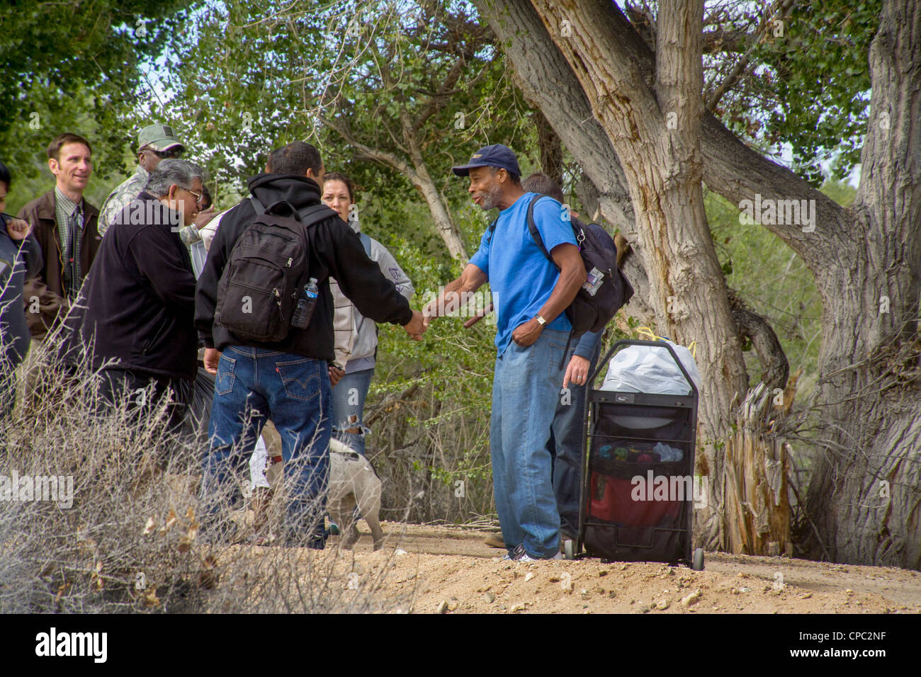 A homeless African-American man talks to representatives of local ...