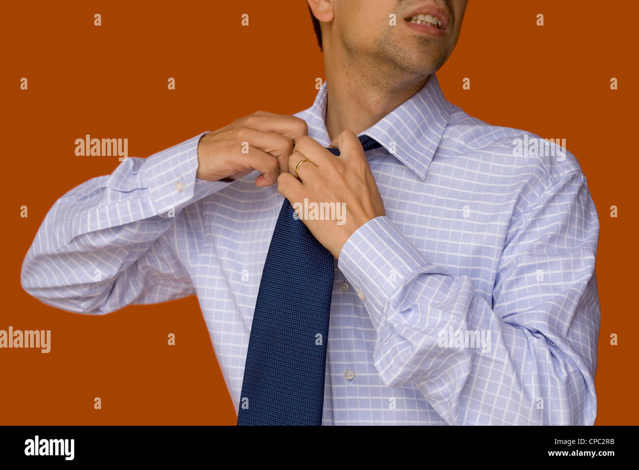 businessman taking off his tie with anger Stock Photo - Alamy