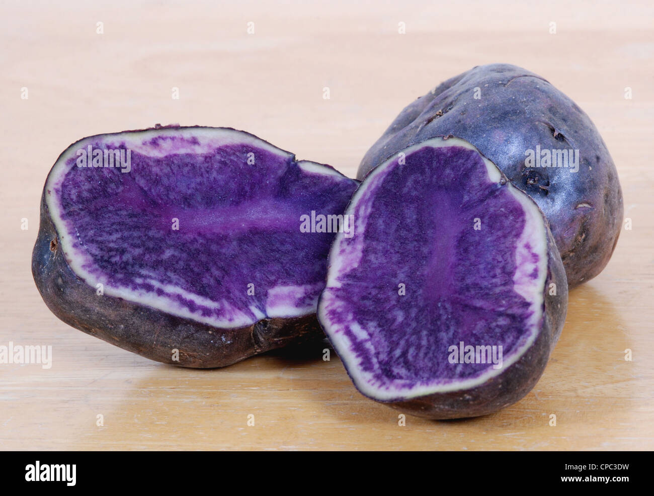 Close up of blue potatoes, sliced in half Stock Photo - Alamy