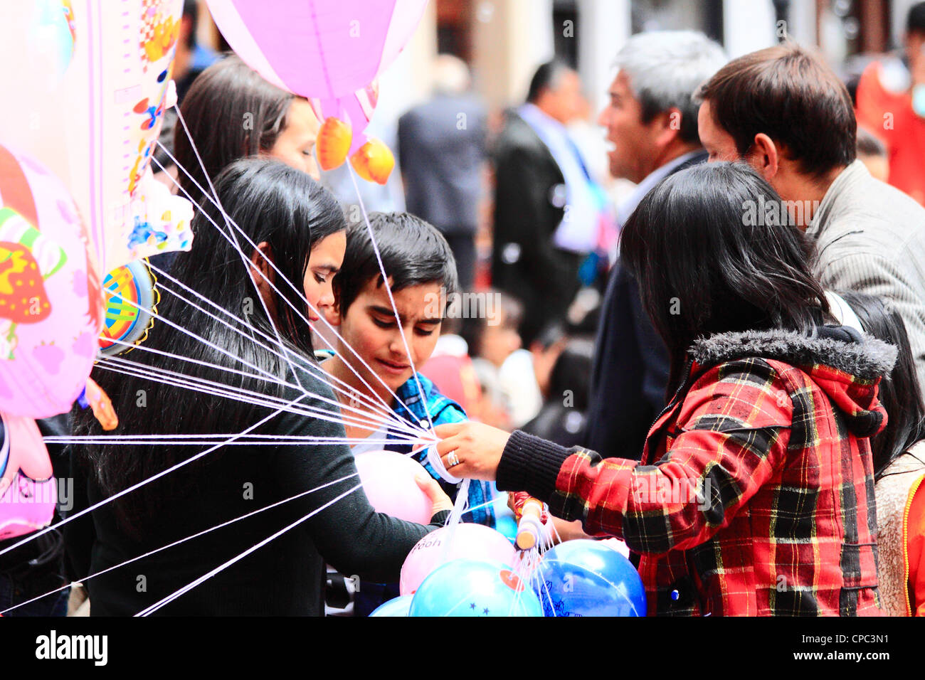 Child selling balloons hi-res stock photography and images - Alamy
