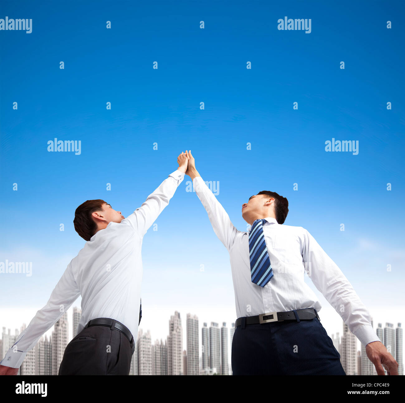 two businessmen with success gesture Stock Photo - Alamy