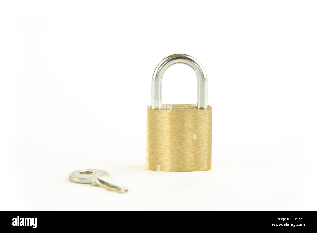 Gold lock set against a white background Stock Photo - Alamy
