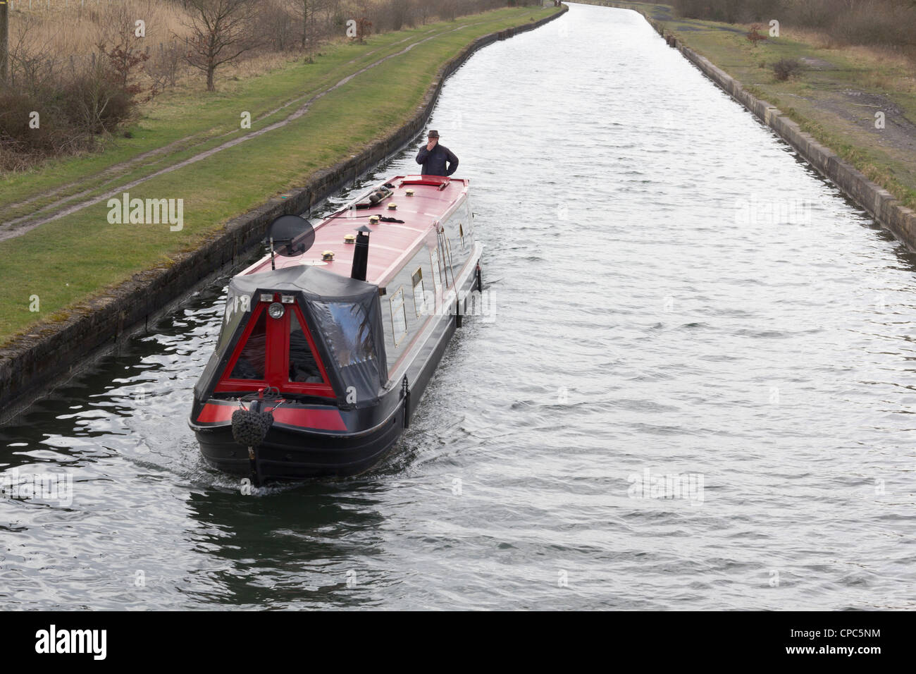 A narrowboat sailing towards Manchester on the Bridgewater canal ...