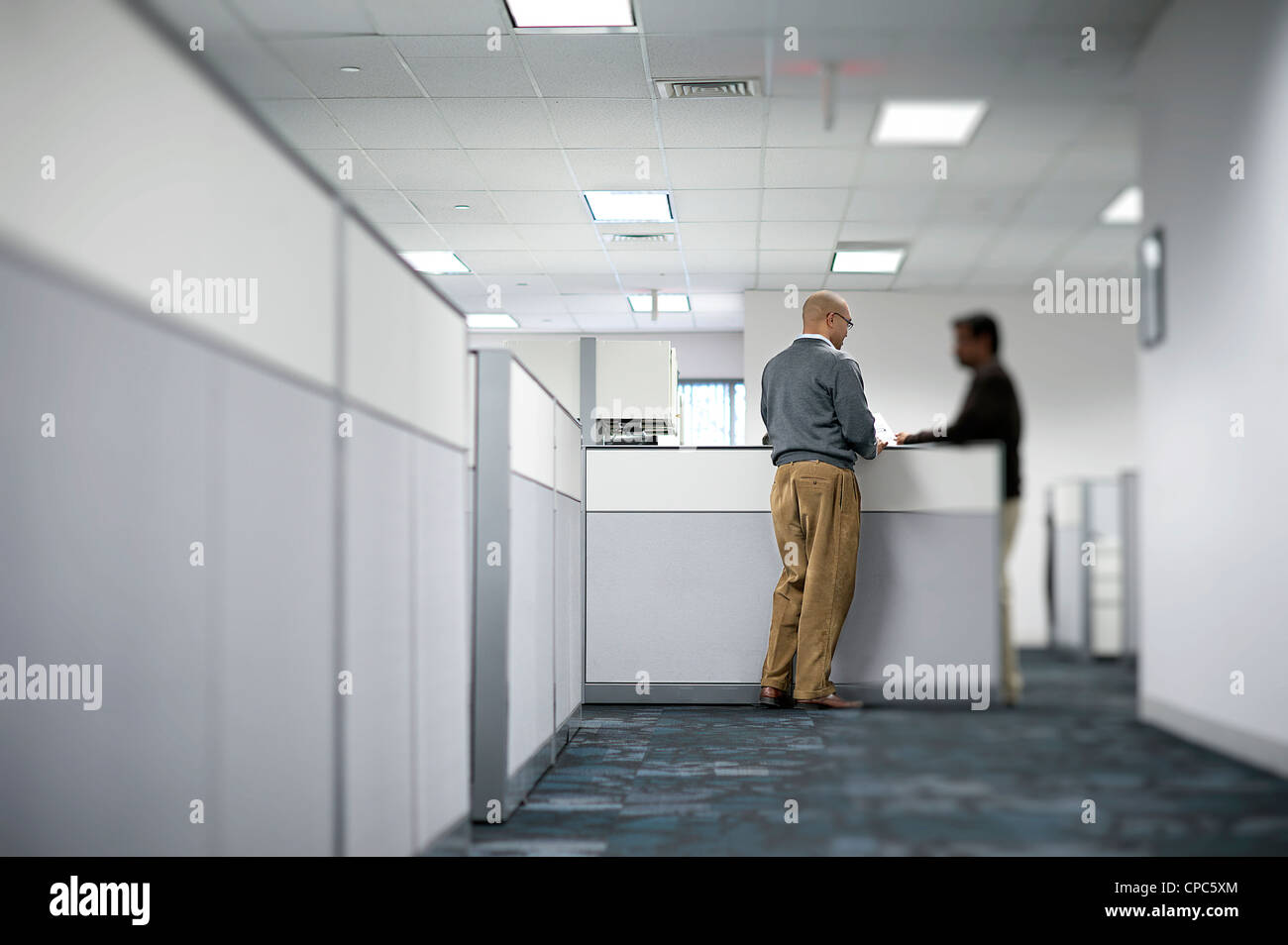 People standing around office cubicles in discussion Stock Photo - Alamy