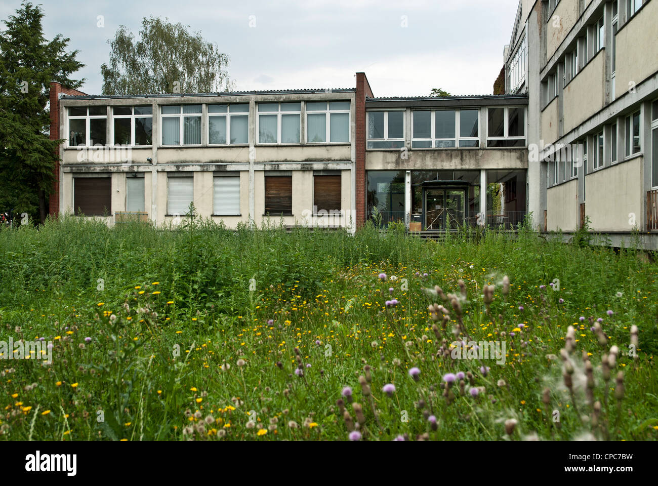Entrance of a derelict school building with copy space Stock Photo - Alamy