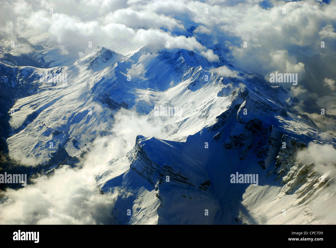 Aerial view of the ALPS mountains through the windows of an airplane ...