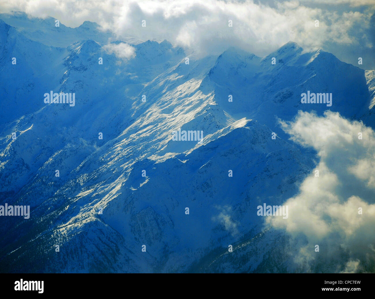 Aerial view of the ALPS mountains through the windows of an airplane ...