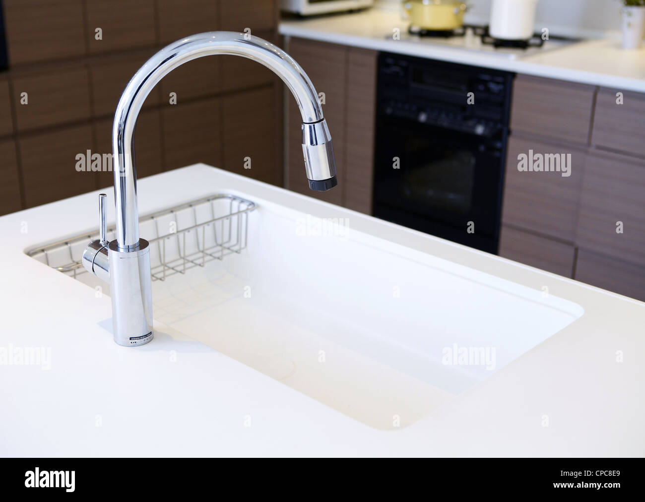 Tap in a kitchen Stock Photo - Alamy