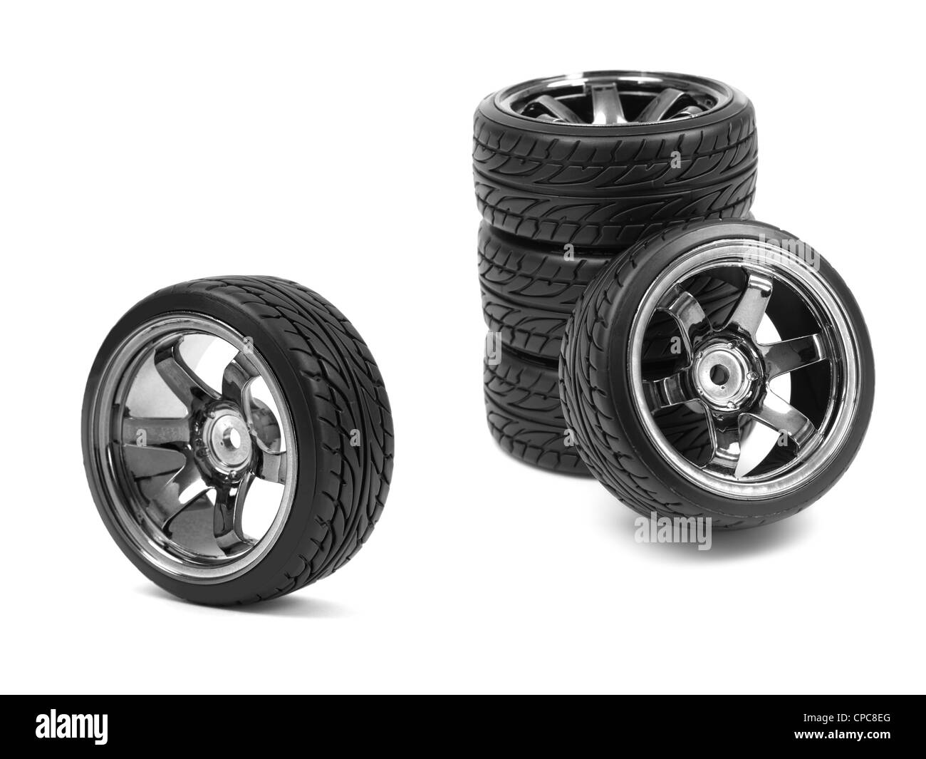 Rubber tyres with sports rims on a white background Stock Photo - Alamy