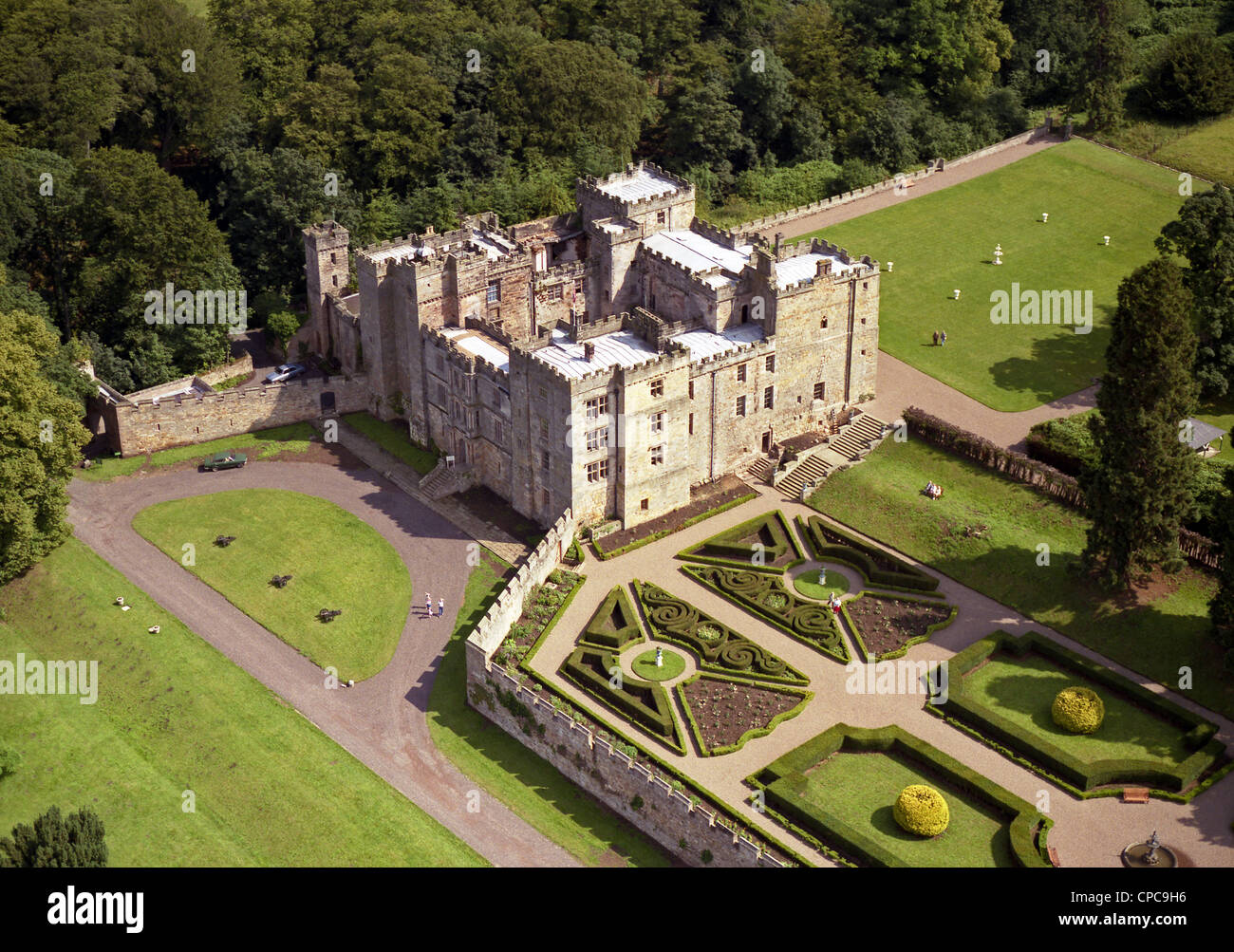 historic aerial view of Chillingham Castle, Northumberland taken in ...