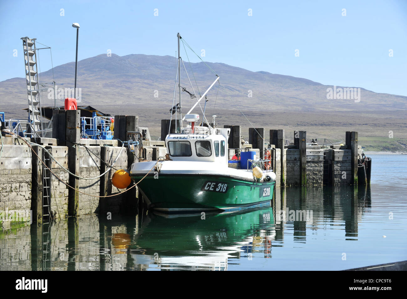 fishing boat in the harbour at Port Askaig on the Scottish island of ...