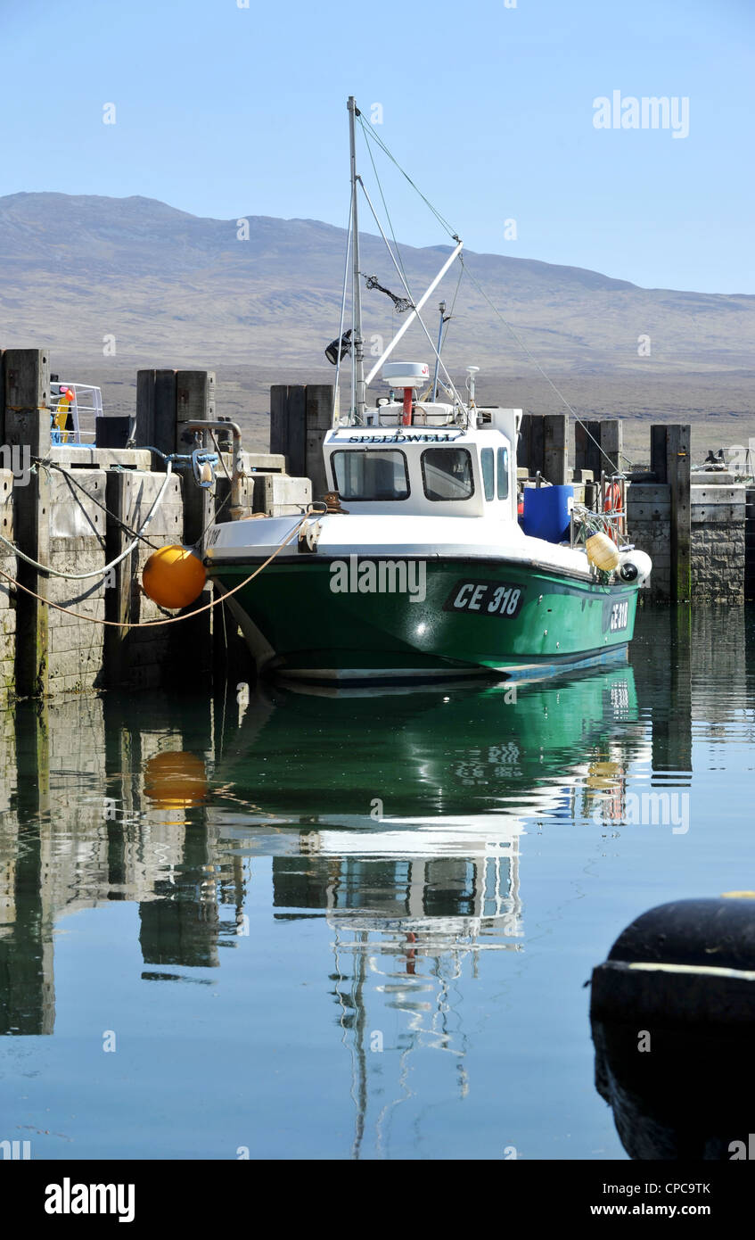 fishing boat in the harbour at Port Askaig on the Scottish island of ...