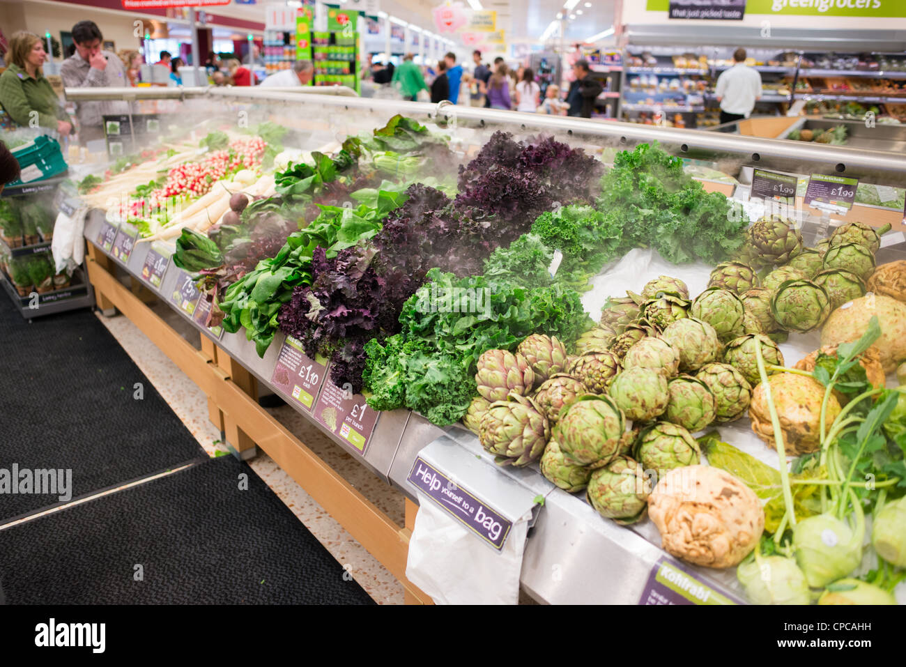 Supermarket fresh vegetable counter. UK Stock Photo - Alamy