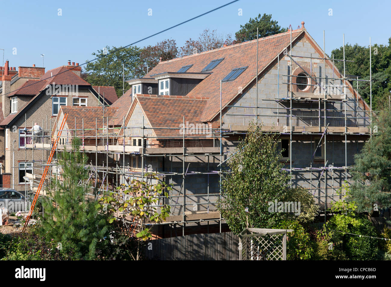 Pair of Semi's under construction by small builder Stock Photo - Alamy