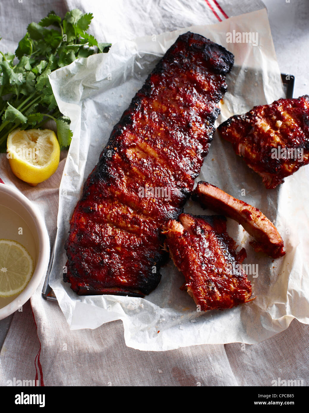 Rack of sticky pork ribs with lemon Stock Photo - Alamy