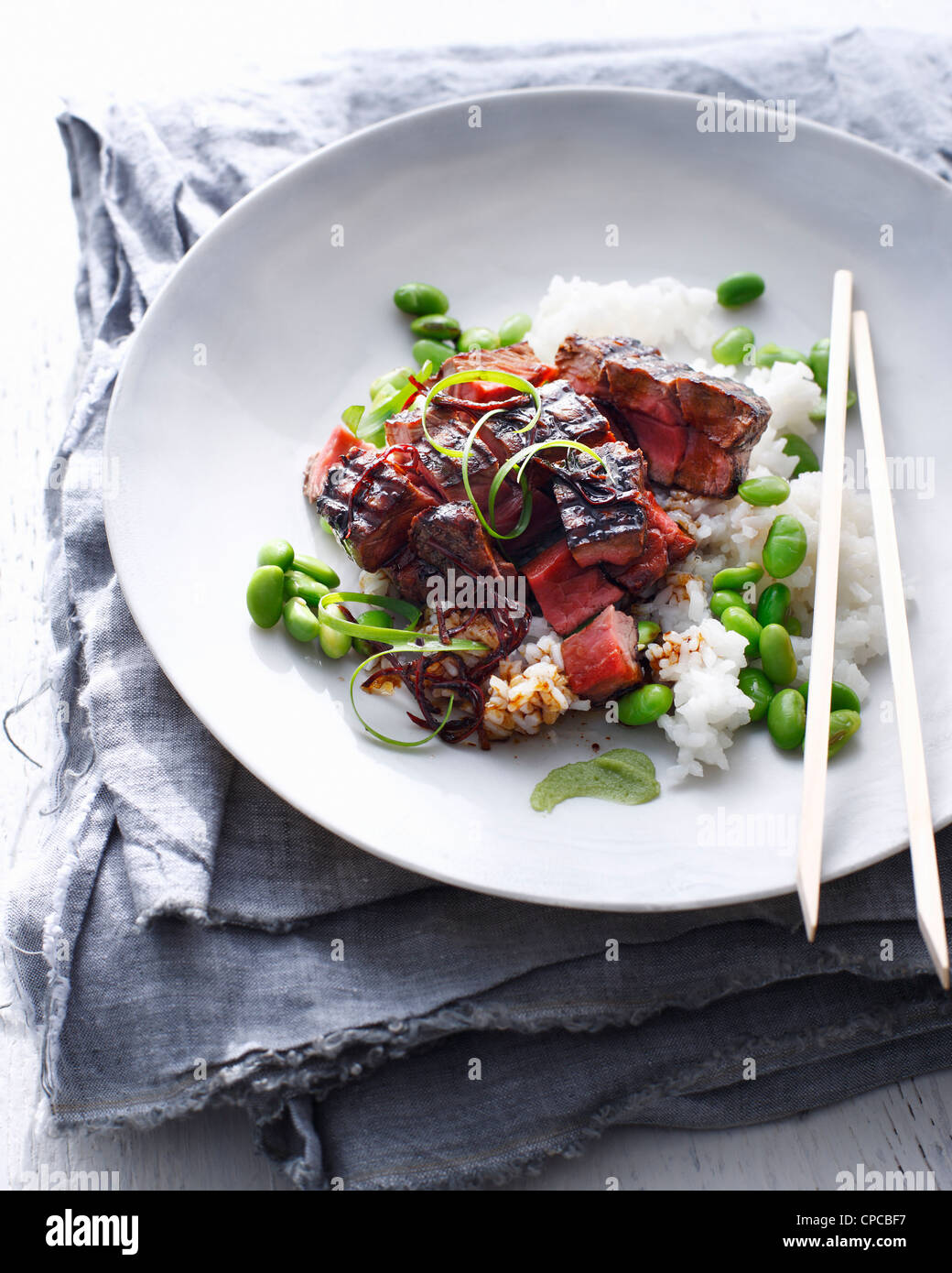 Plate of beef with lima beans and rice Stock Photo - Alamy