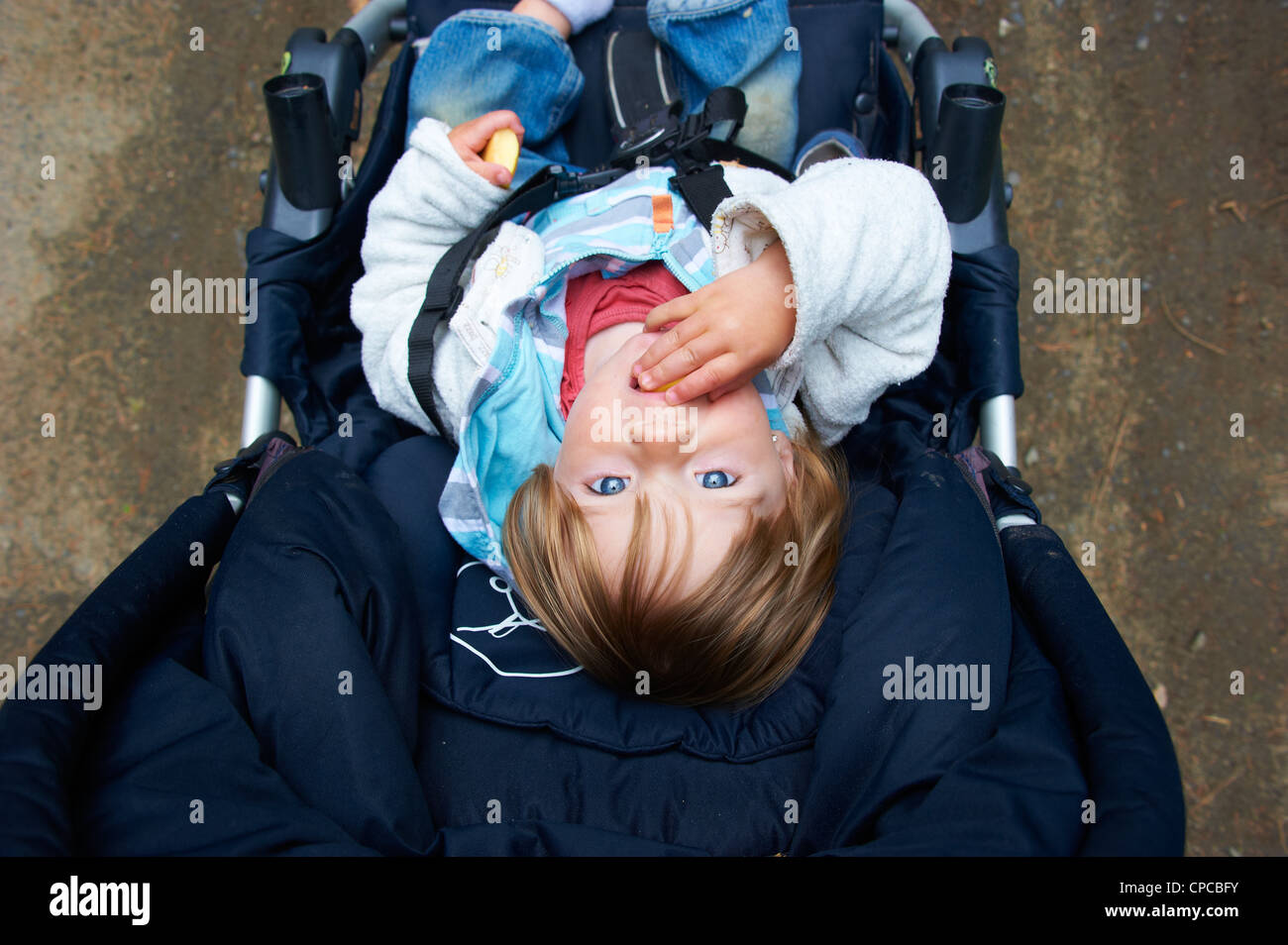 Baby girl in a pram Stock Photo - Alamy