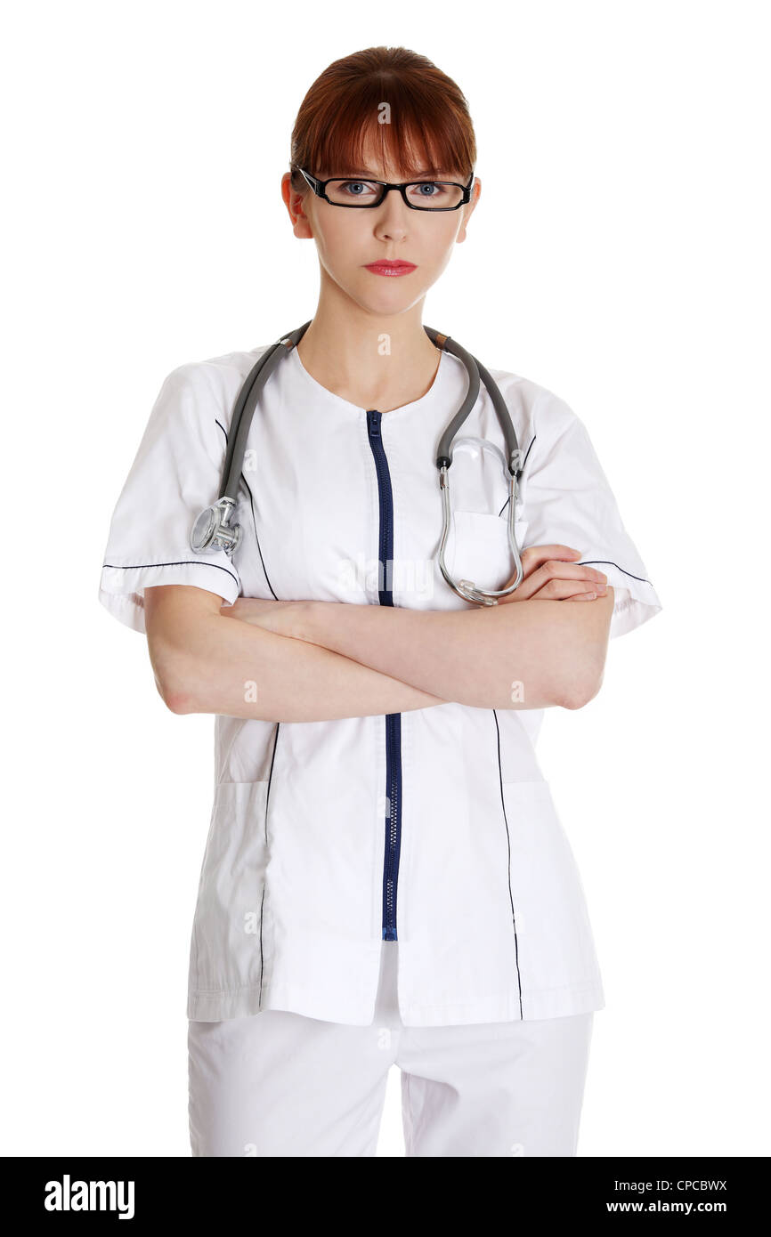 Serious nurse or young female medical doctor isolated on white ...