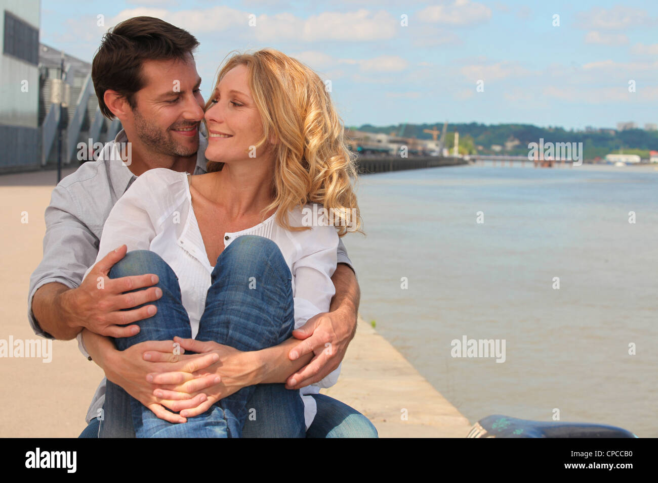 Man woman link arms hi-res stock photography and images - Alamy