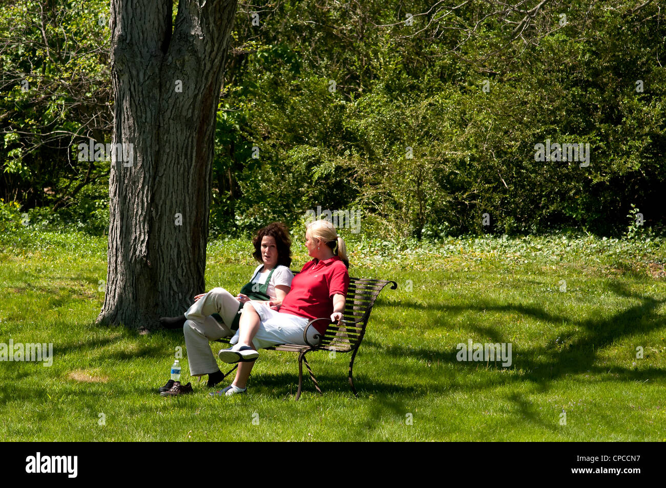 Two ladies on bench Stock Photo - Alamy