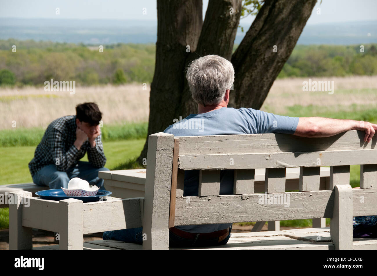 Sitting on bench Stock Photo - Alamy