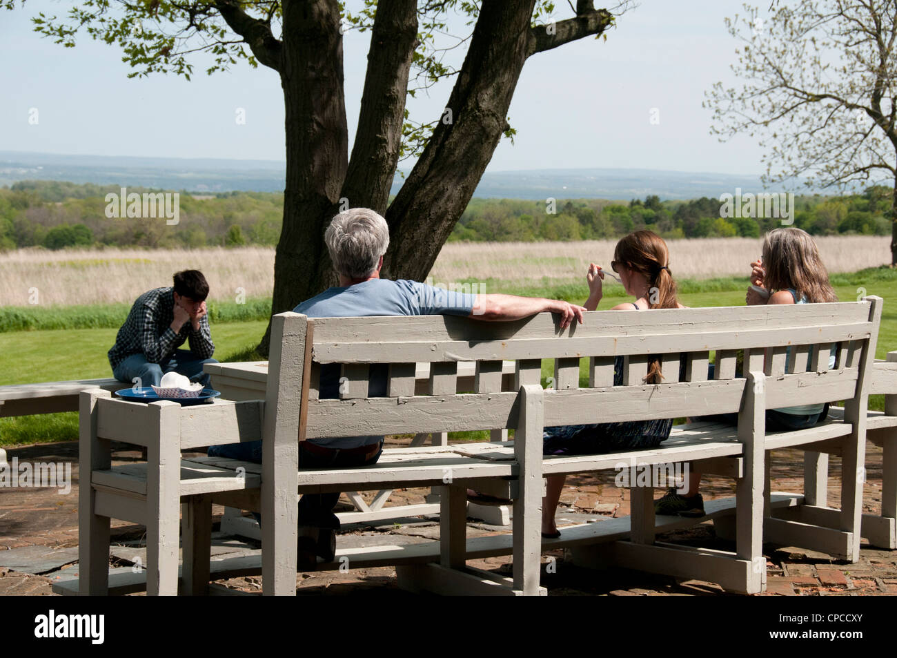 Sitting on bench Stock Photo - Alamy