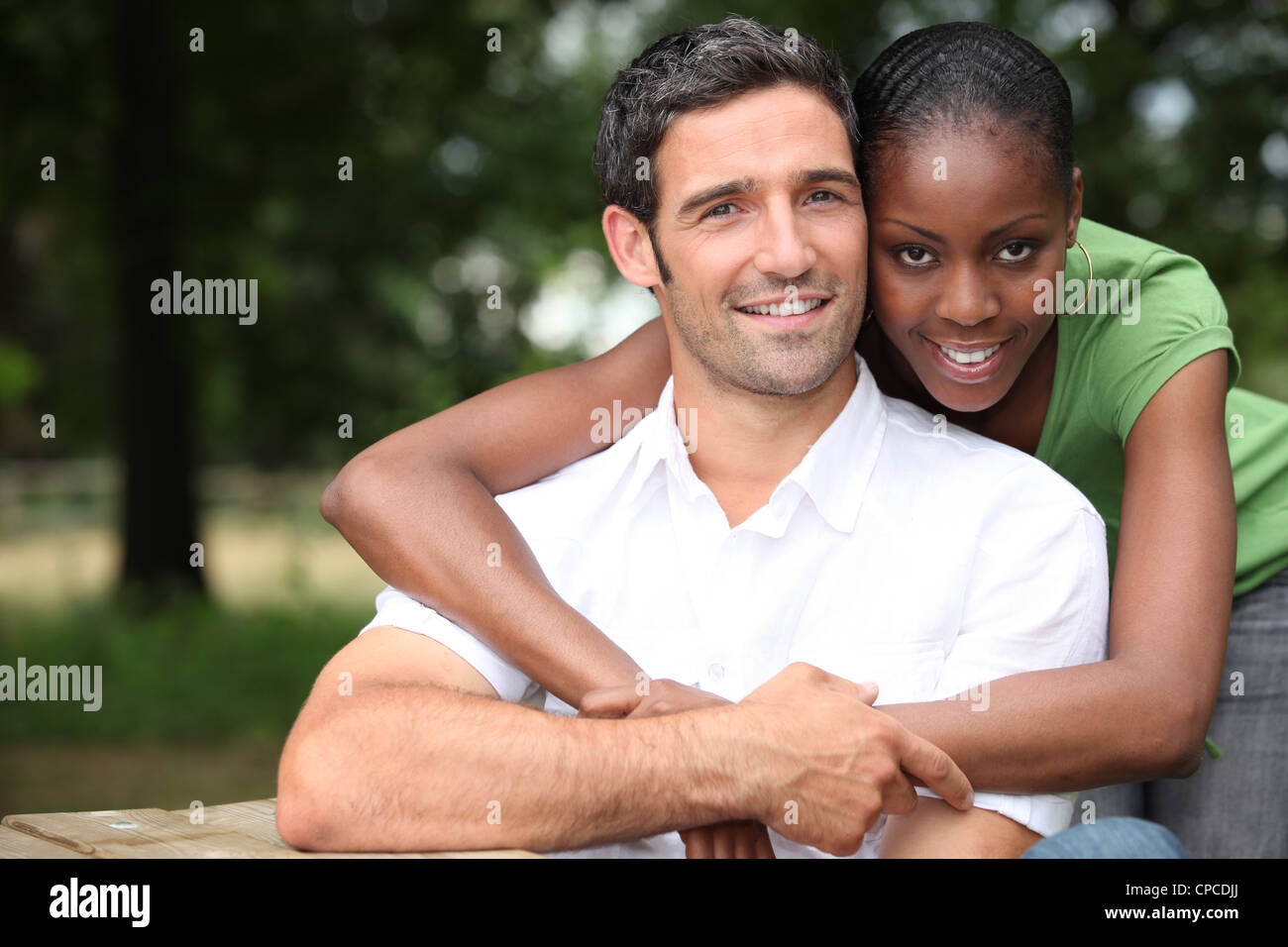 Mixed-race couple at the park Stock Photo - Alamy