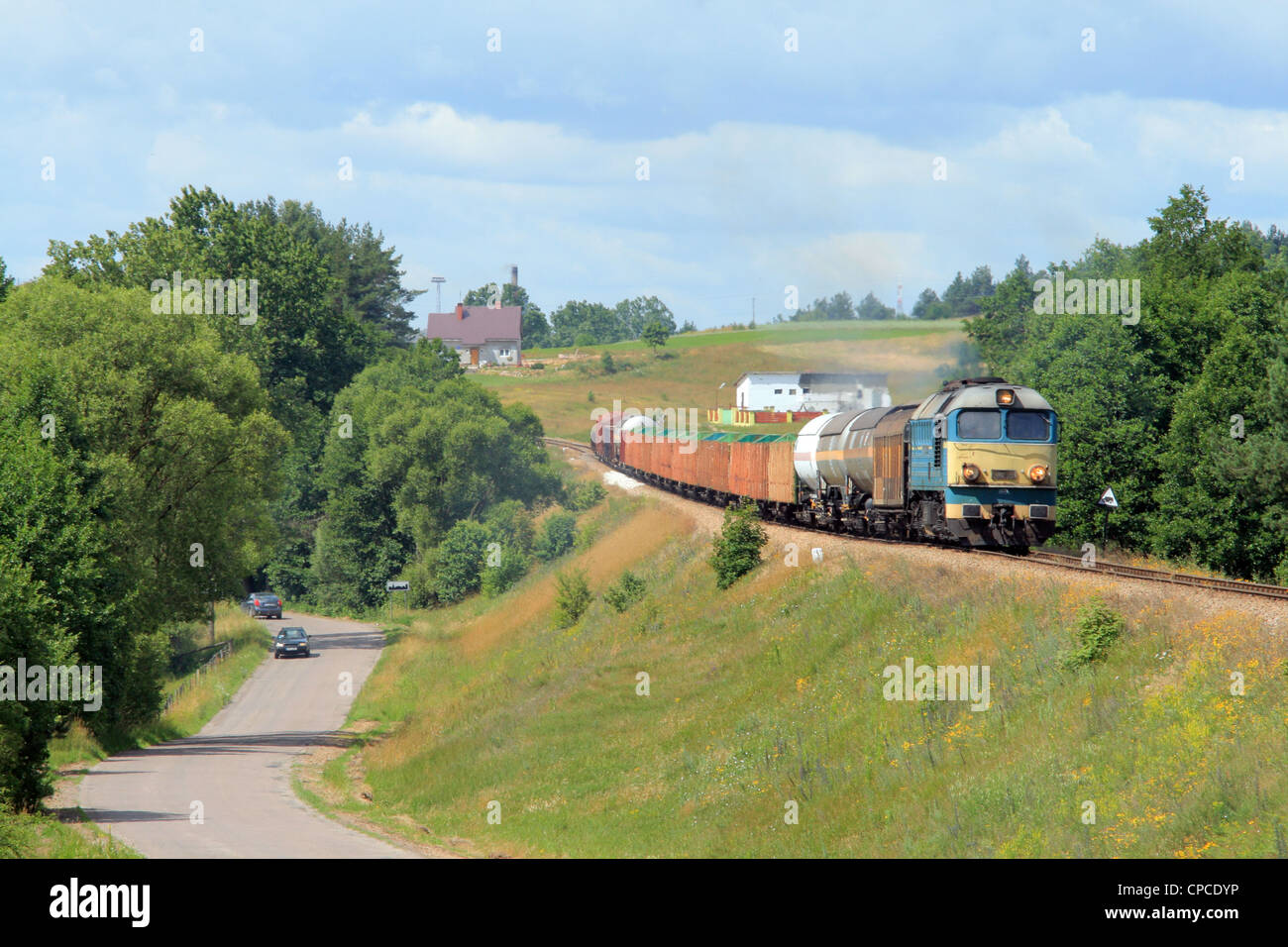 Rural summer landscape with freight train Stock Photo - Alamy